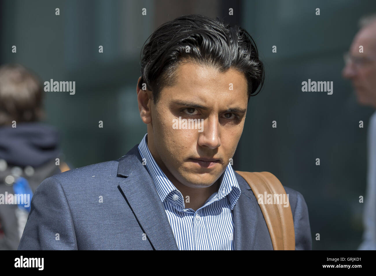 City trader Daniel Green, 26, leaves the Old Bailey in London where he ...