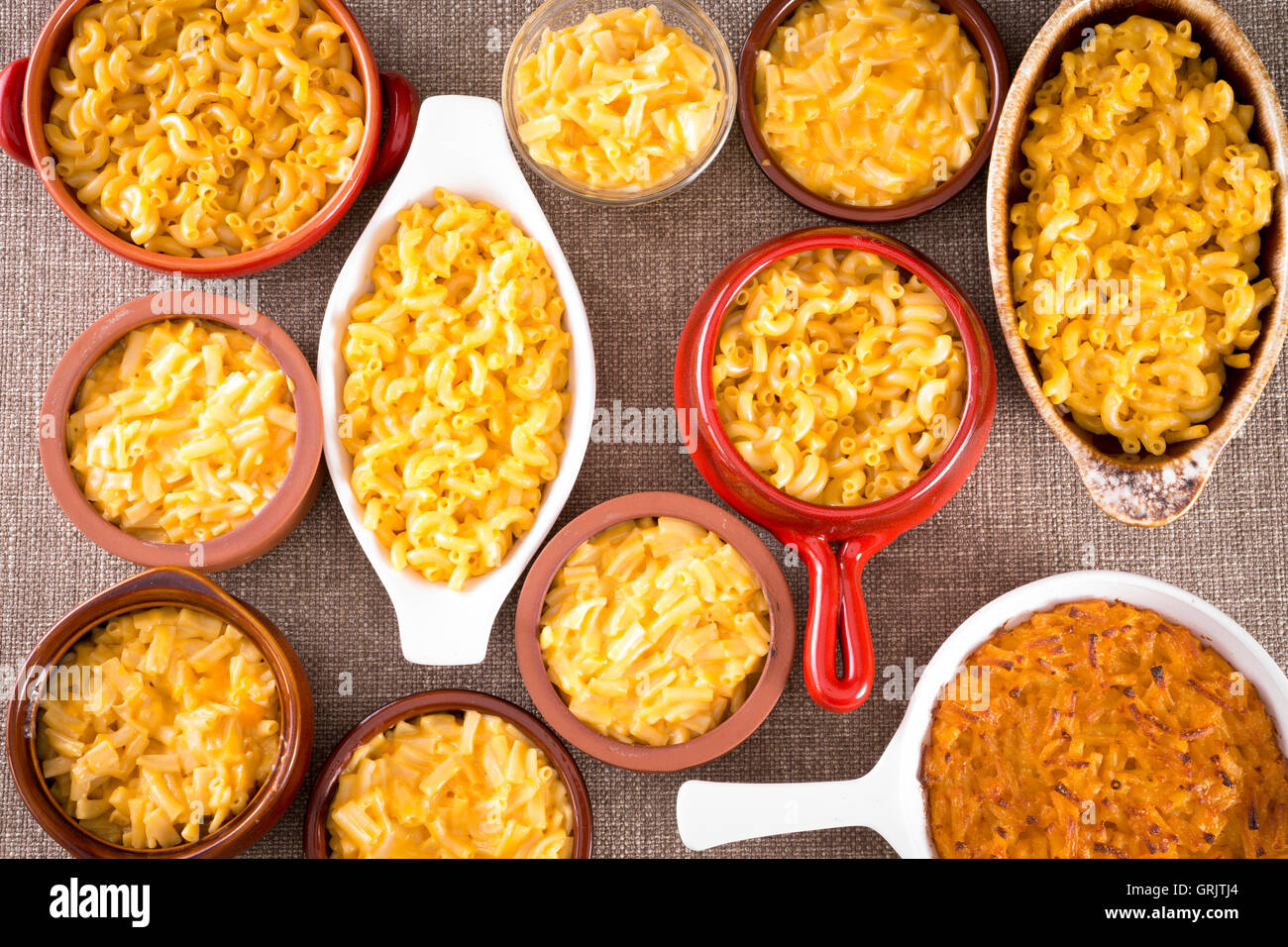 Conceptual above view of cheese macaroni served in diffrent types of ...