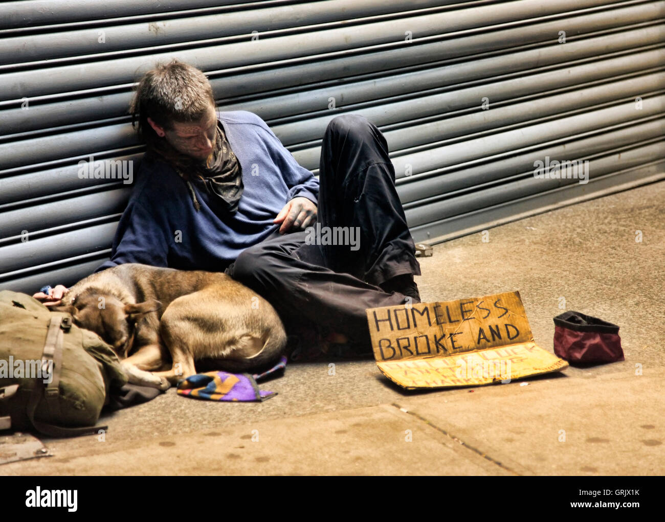 Homeless man dirt dog sleeping hi-res stock photography and images - Alamy