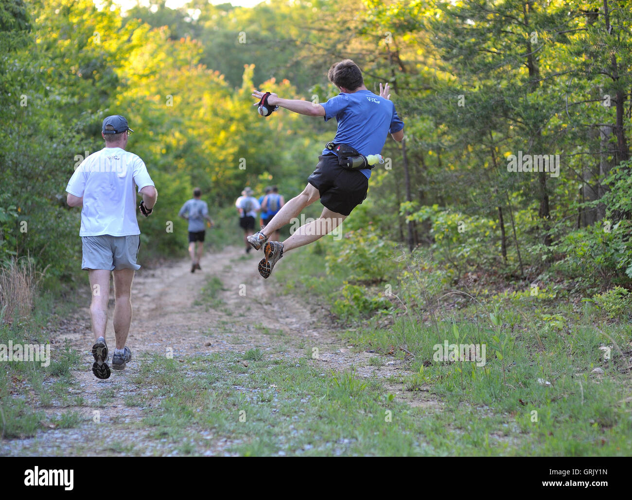 Runner Happy on the trail Stock Photo - Alamy