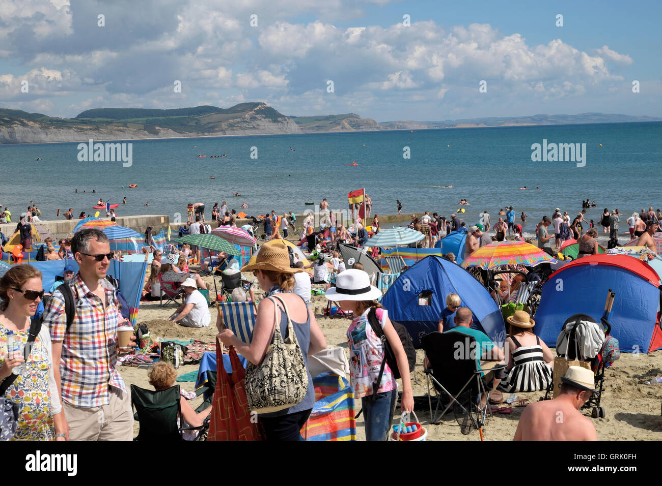 People families enjoying the sunny August weather sunshine at the end ...
