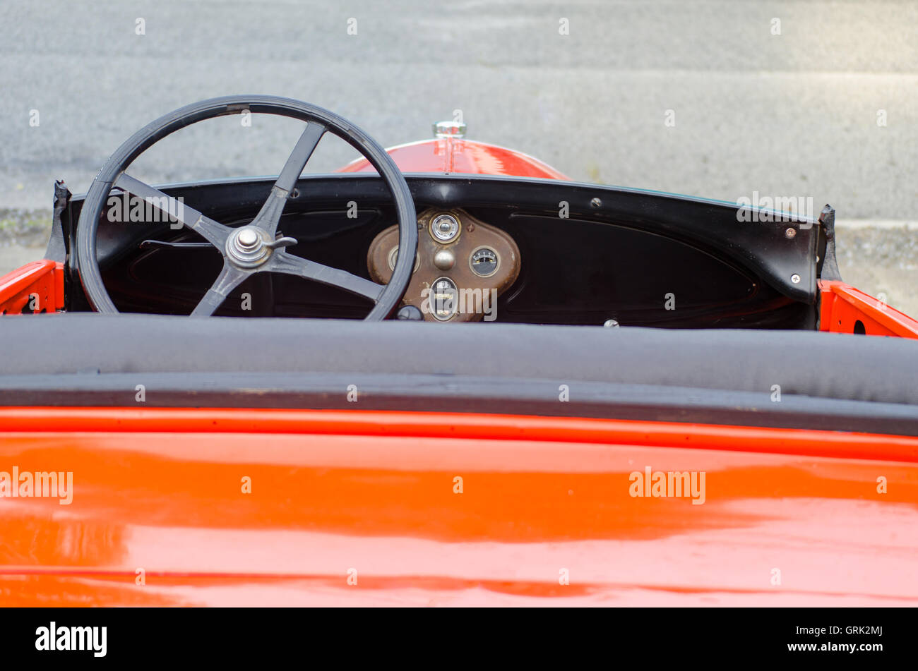 Red vintage old timer car parked on the street Stock Photo - Alamy