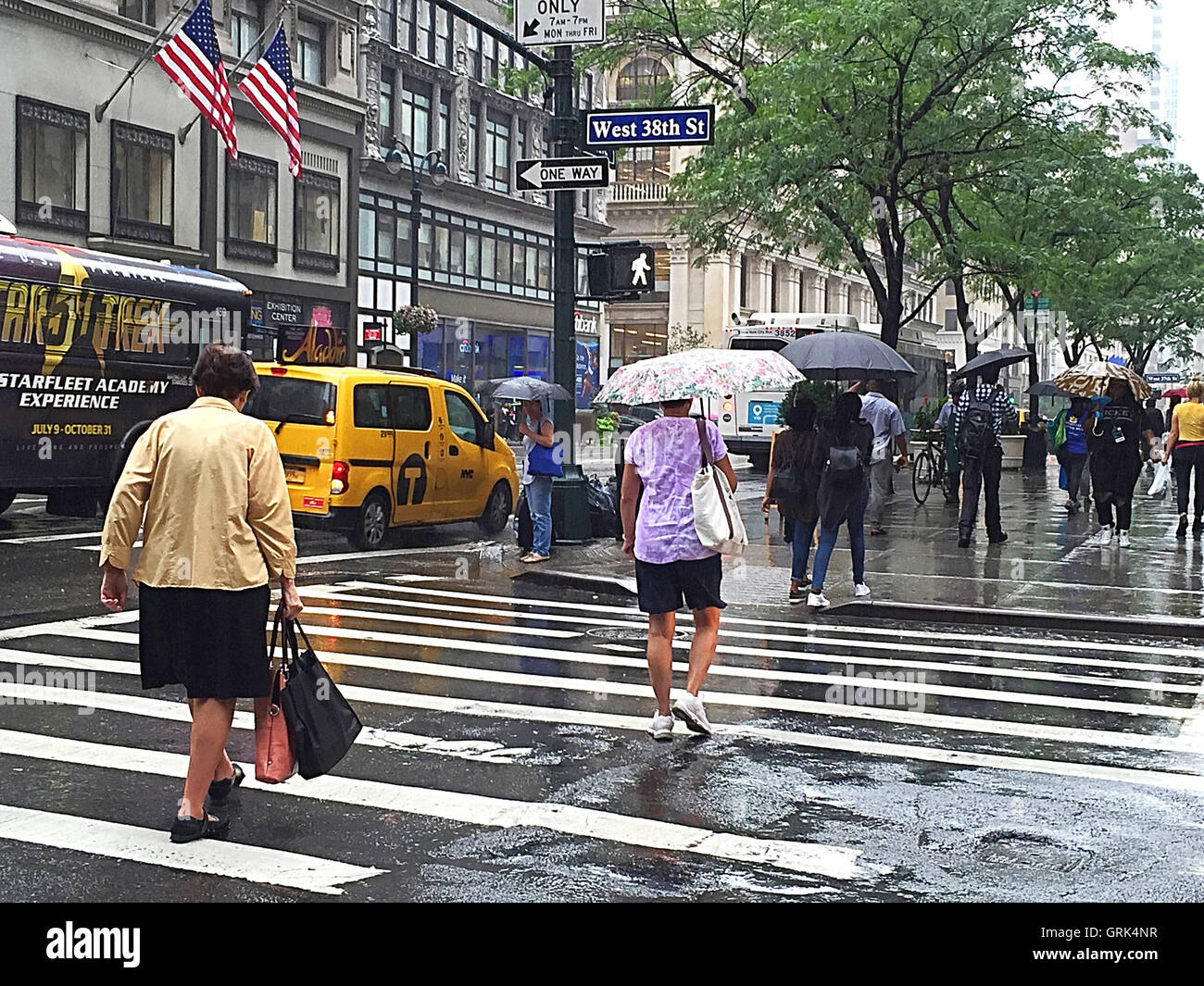 Activity under Brollies on Fifth Avenue during Rainstorm, New York City ...