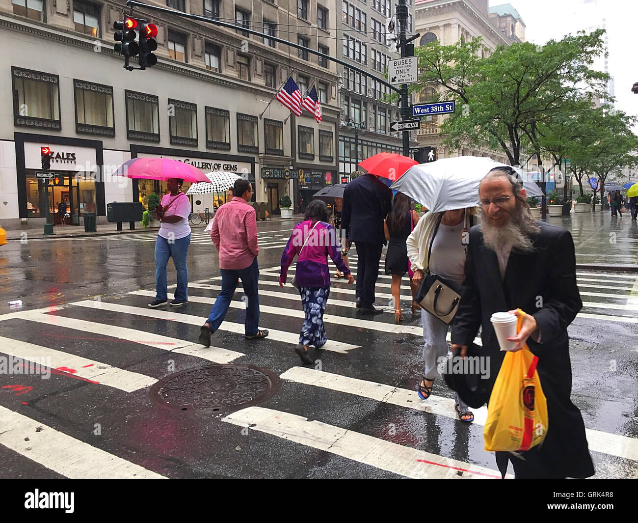 Activity under Brollies on Fifth Avenue during Rainstorm, New York City ...