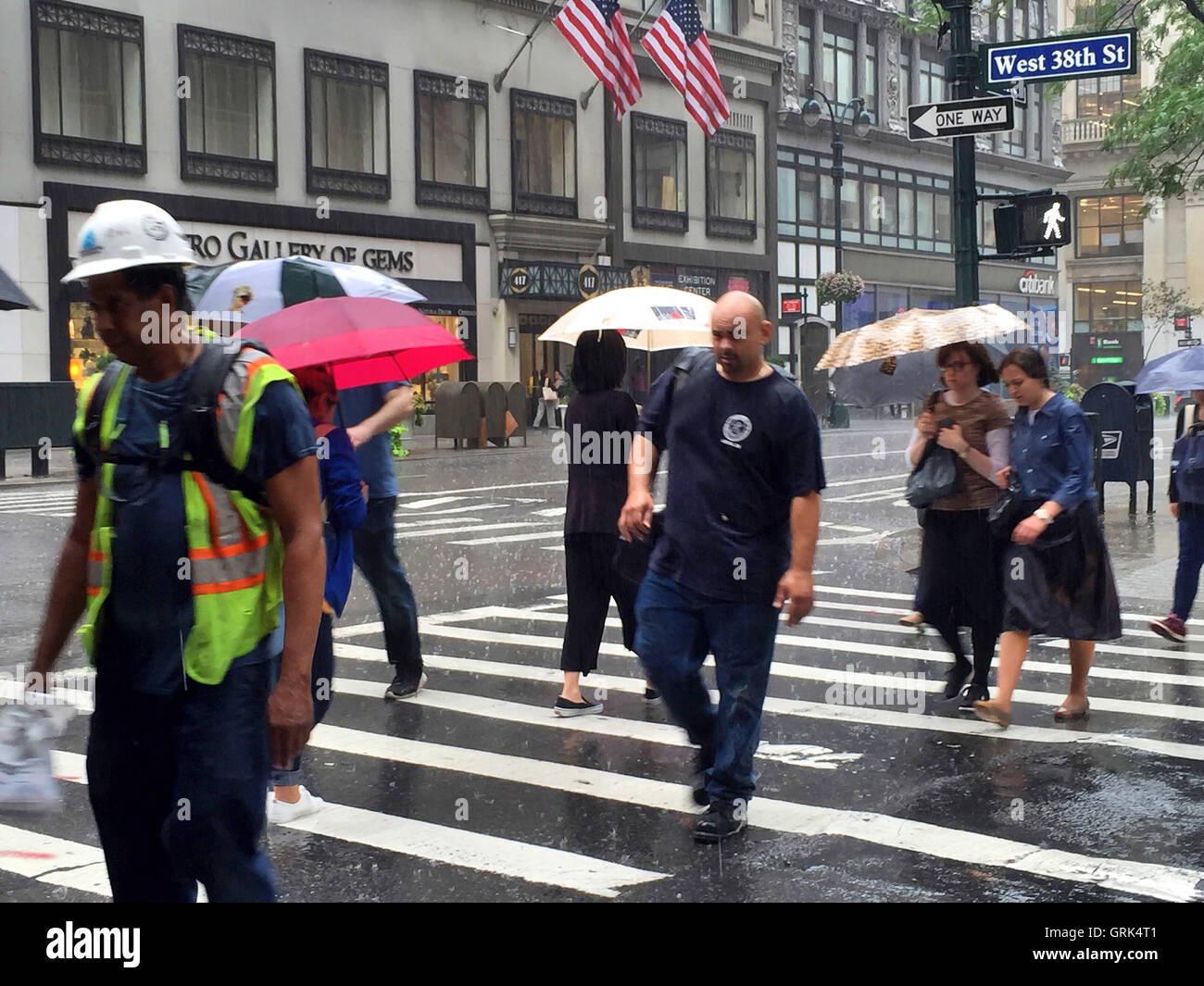 Activity on Fifth Avenue during Rainstorm under Brollies, New York City ...