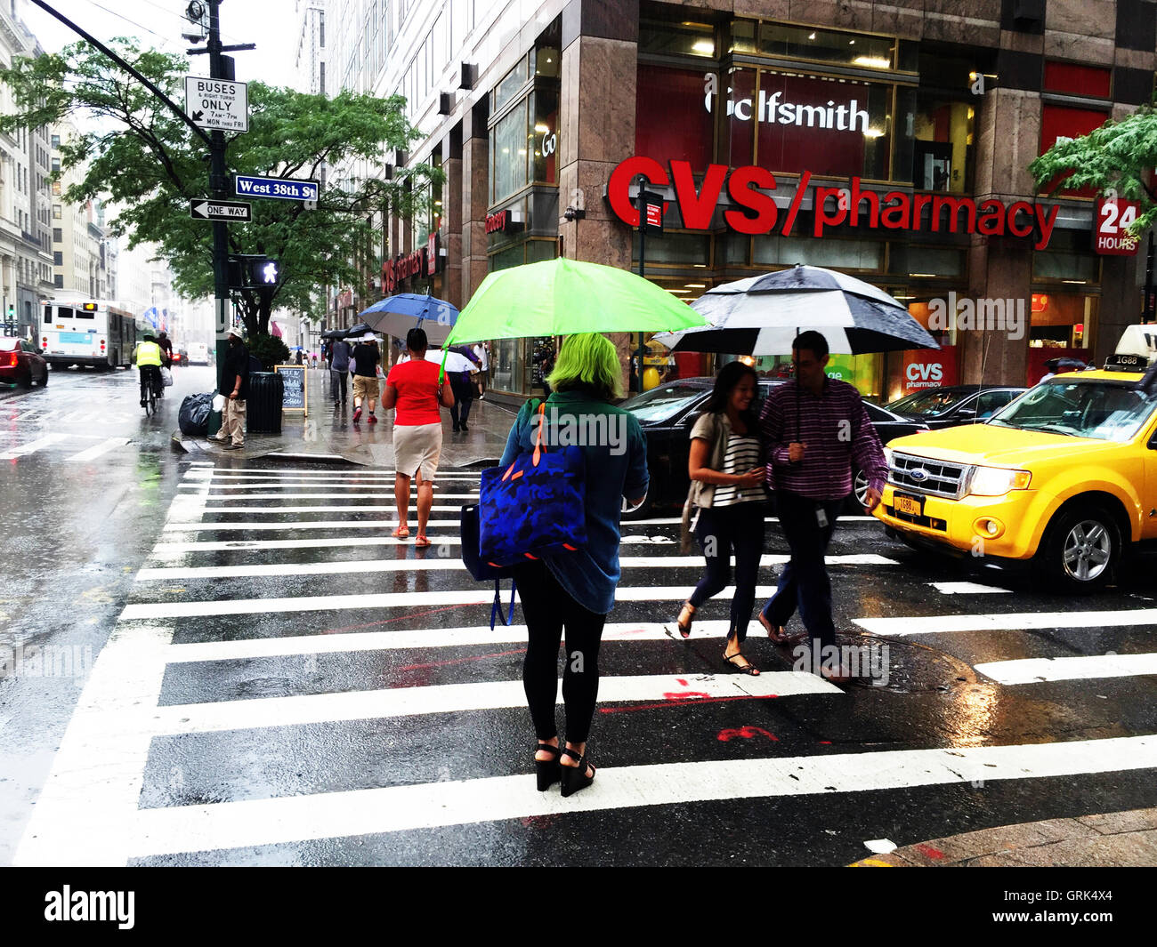Activity on Fifth Avenue during Rainstorm under Brollies, New York City ...