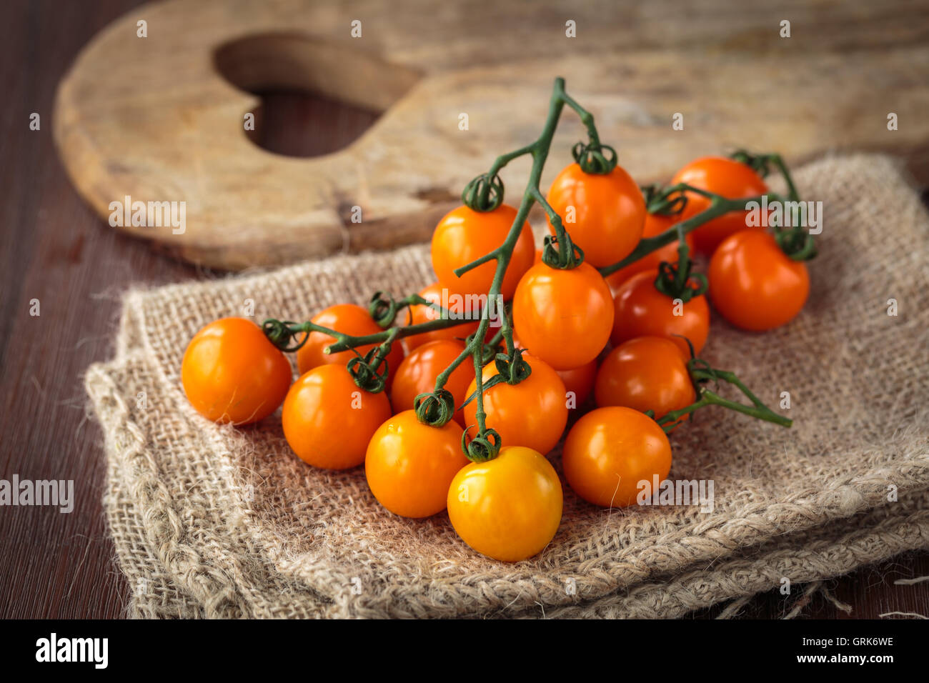 Fresh raw orange cherry tomatoes for an healthy nutrition Stock Photo - Alamy