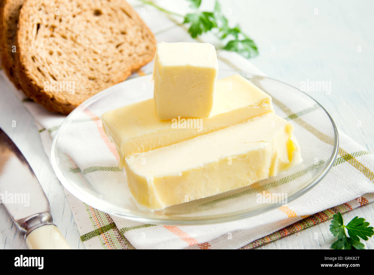 Butter over rustic white wooden background Stock Photo - Alamy