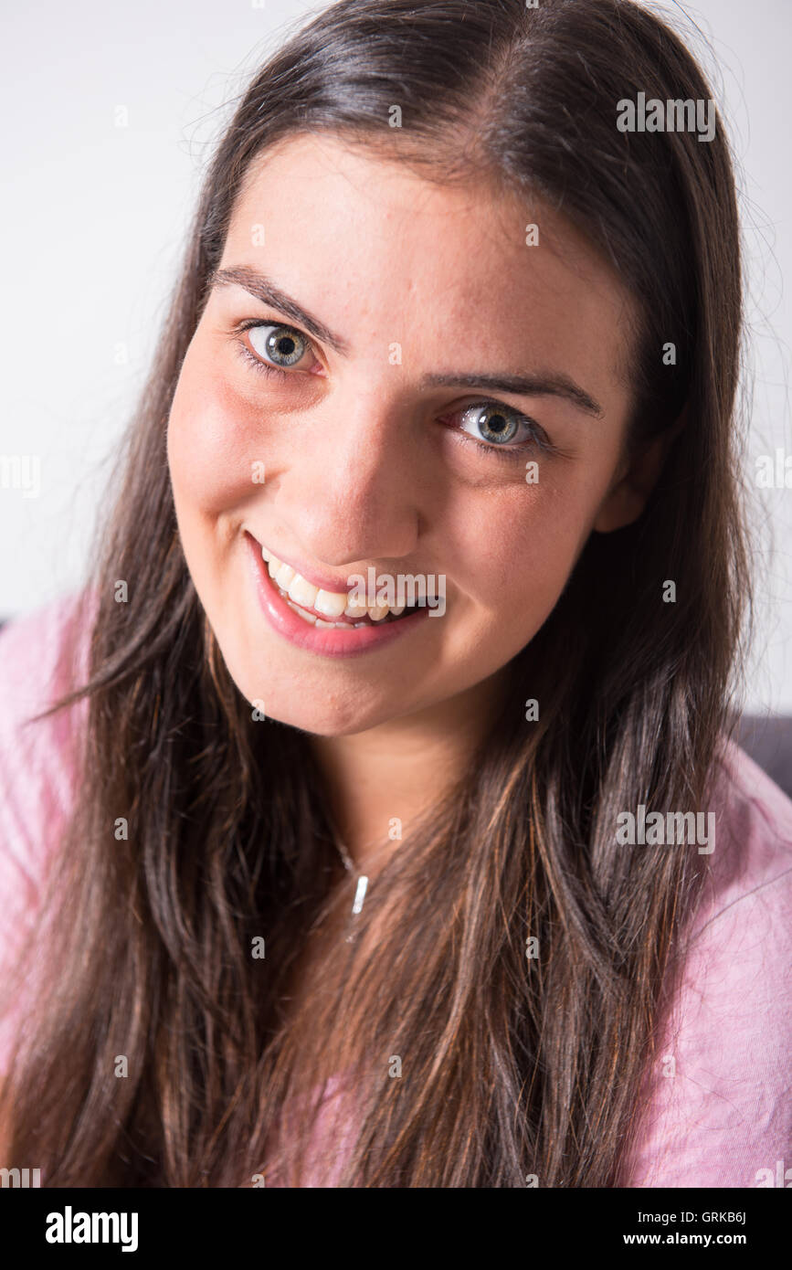 Portrait of a young beautiful woman looking into camera Stock Photo - Alamy