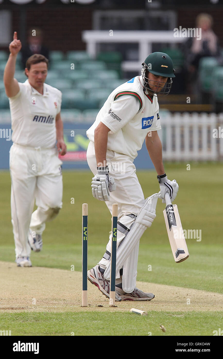 Nathan Buck of Leicestershire is bowled out by Graham Napier ...