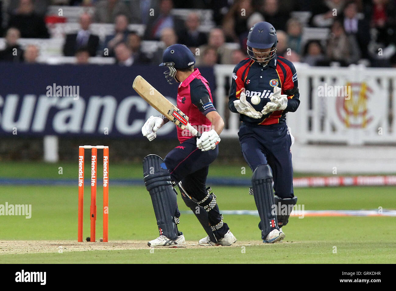 James Foster of Essex holds on to a catch to dismiss Neil Dexter from ...