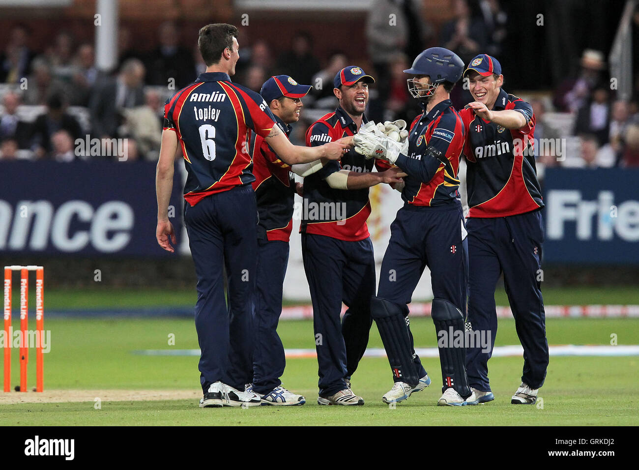 James Foster of Essex holds on to a catch to dismiss Neil Dexter from ...