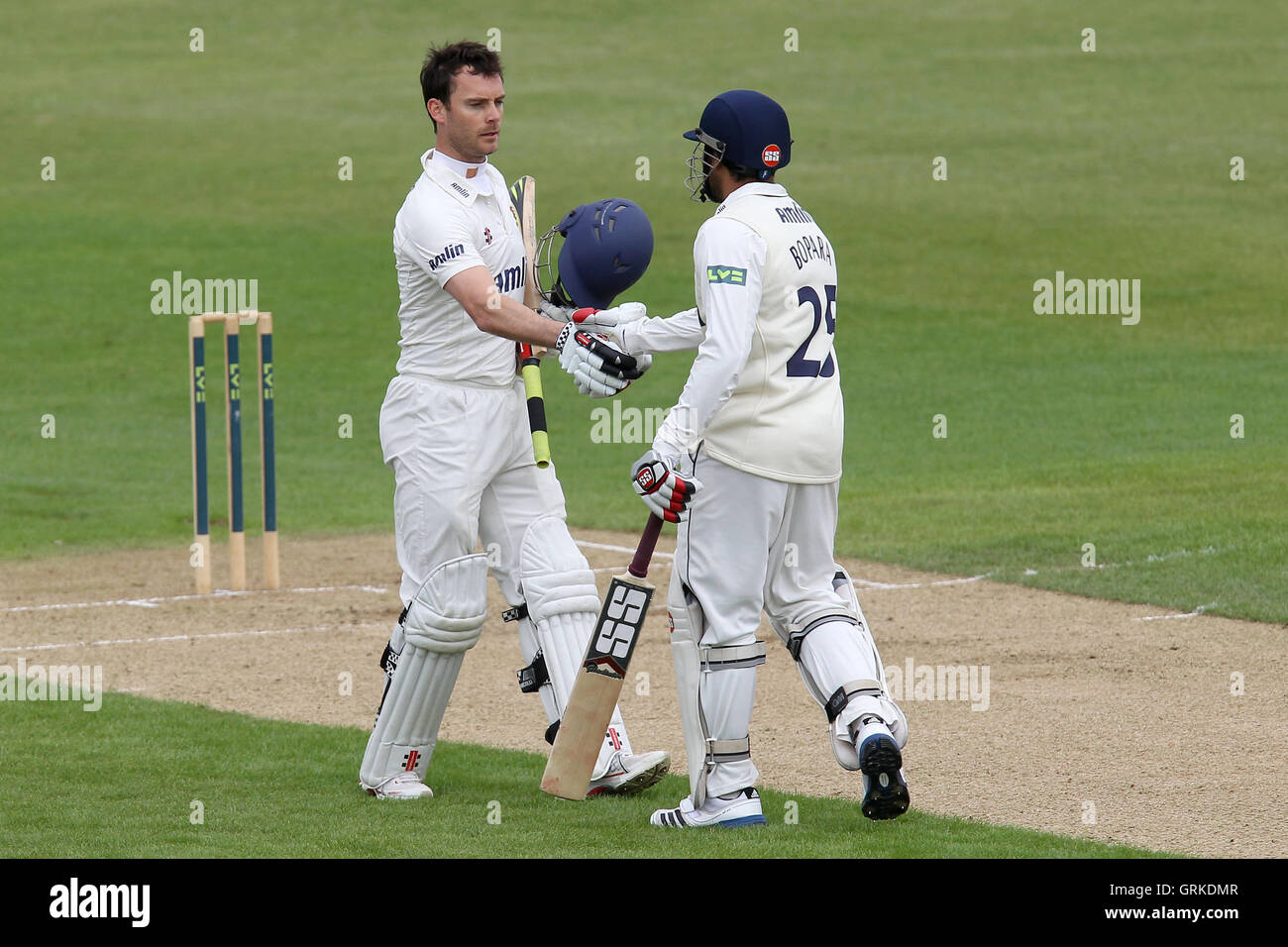 James Foster (L) celebrates a century, 100 runs for Essex with batting ...