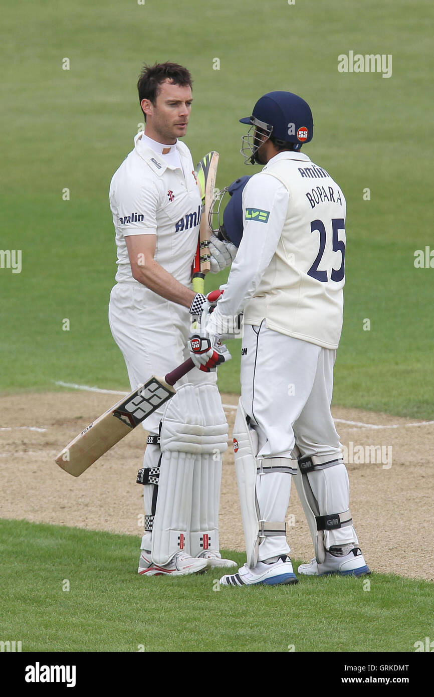 James Foster (L) celebrates a century, 100 runs for Essex with batting ...
