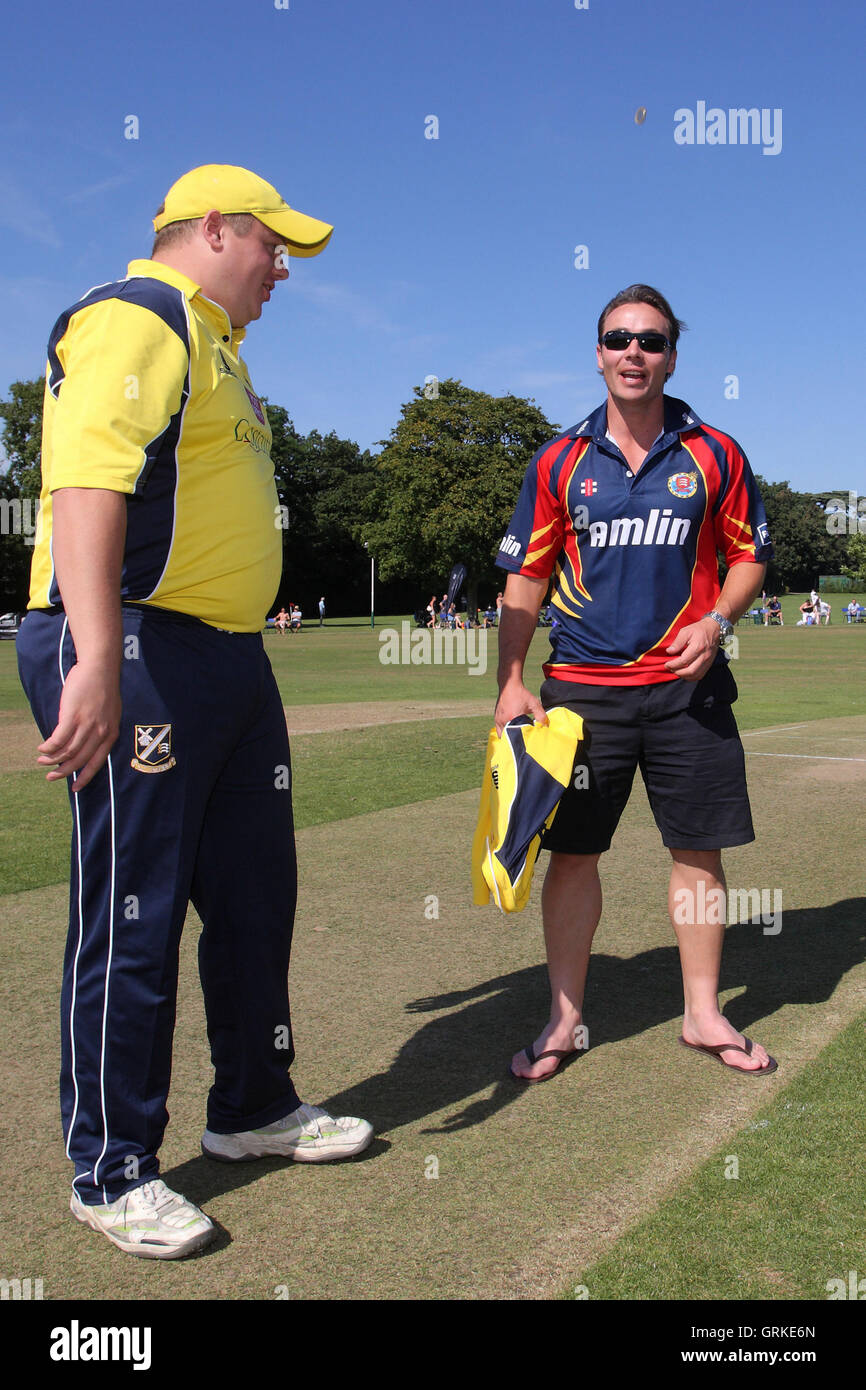 Upminster captain Ollie Peck (L) watches Graham Napier toss the coin ...