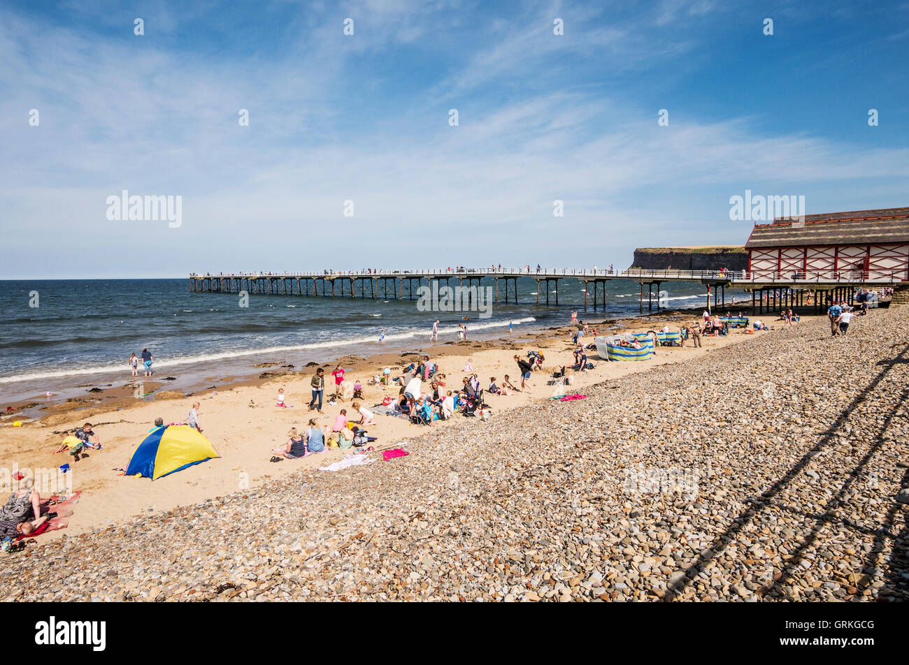 Saltburn-by-the-Sea Cleveland UK Busy beach looking towards the Pier ...