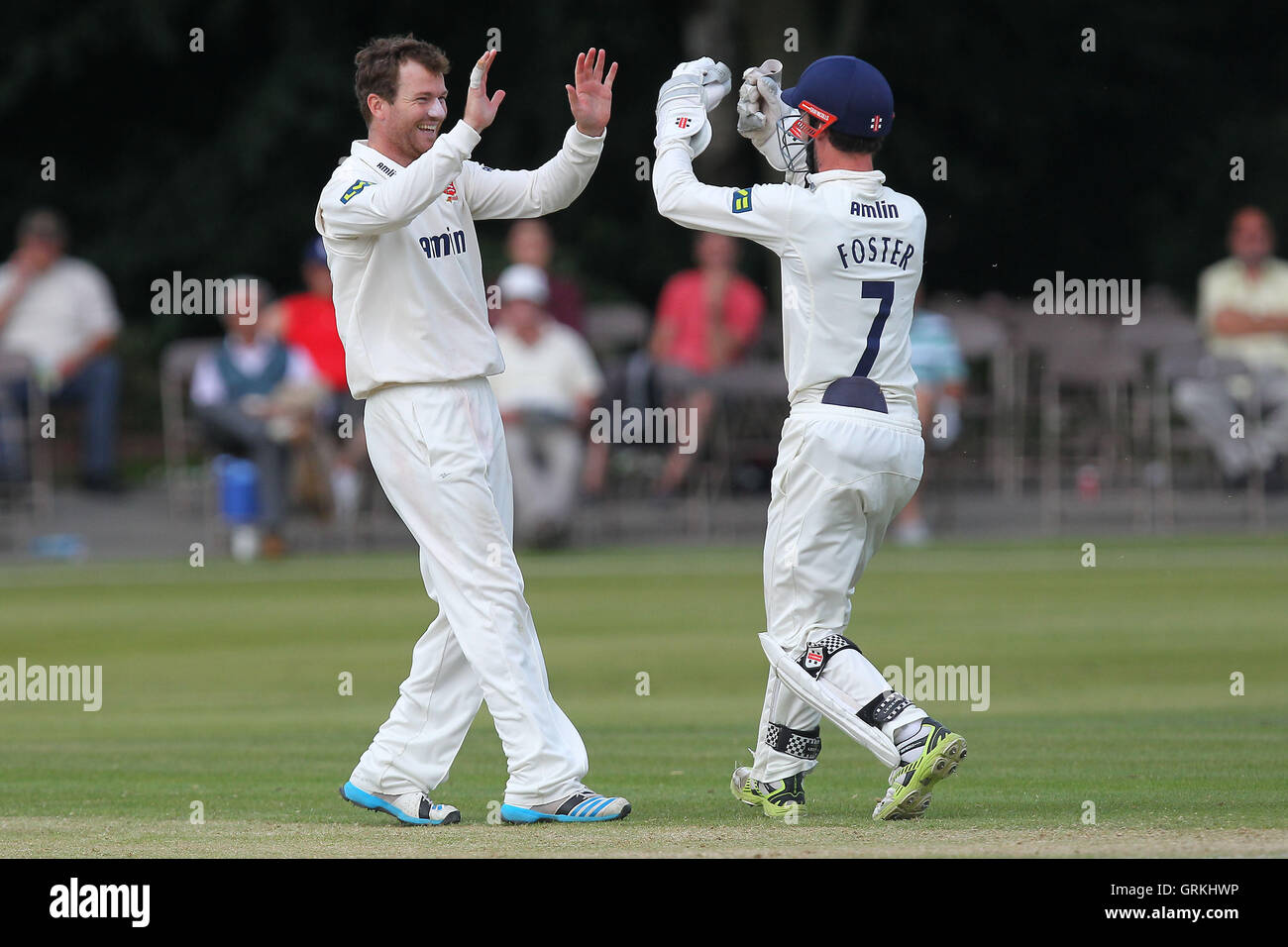 Tim Phillips of Essex (L) celebrates the wicket of Ben Slater with ...