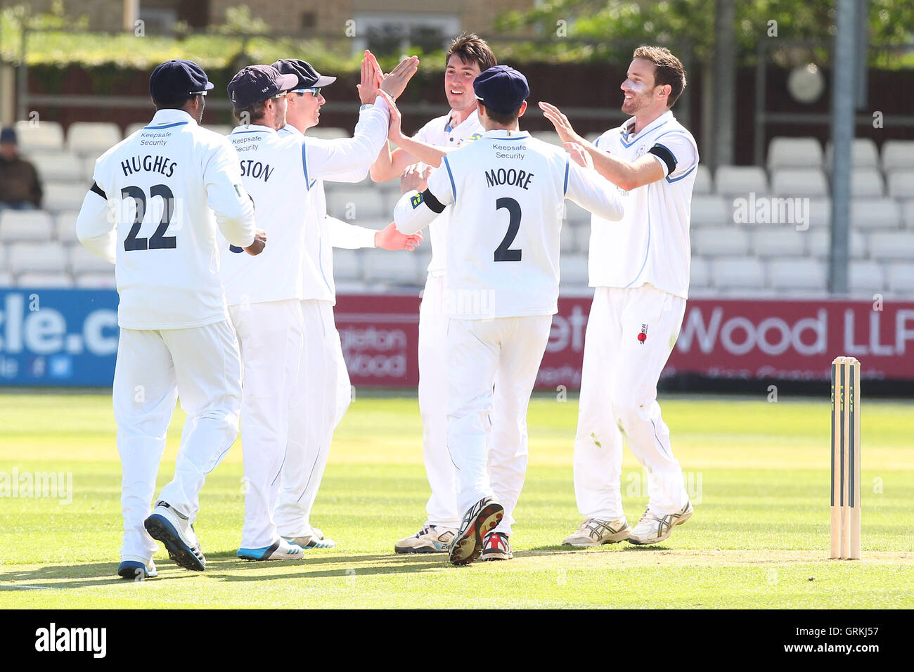 Mark Footitt of Derbyshire (3rd R) celebrates the wicket of Tom Westley ...