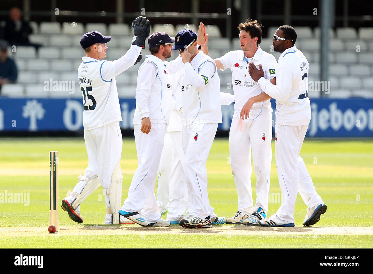 Mark Footitt (2nd R) of Derbyshire celebrates the wicket of Ben Foakes ...
