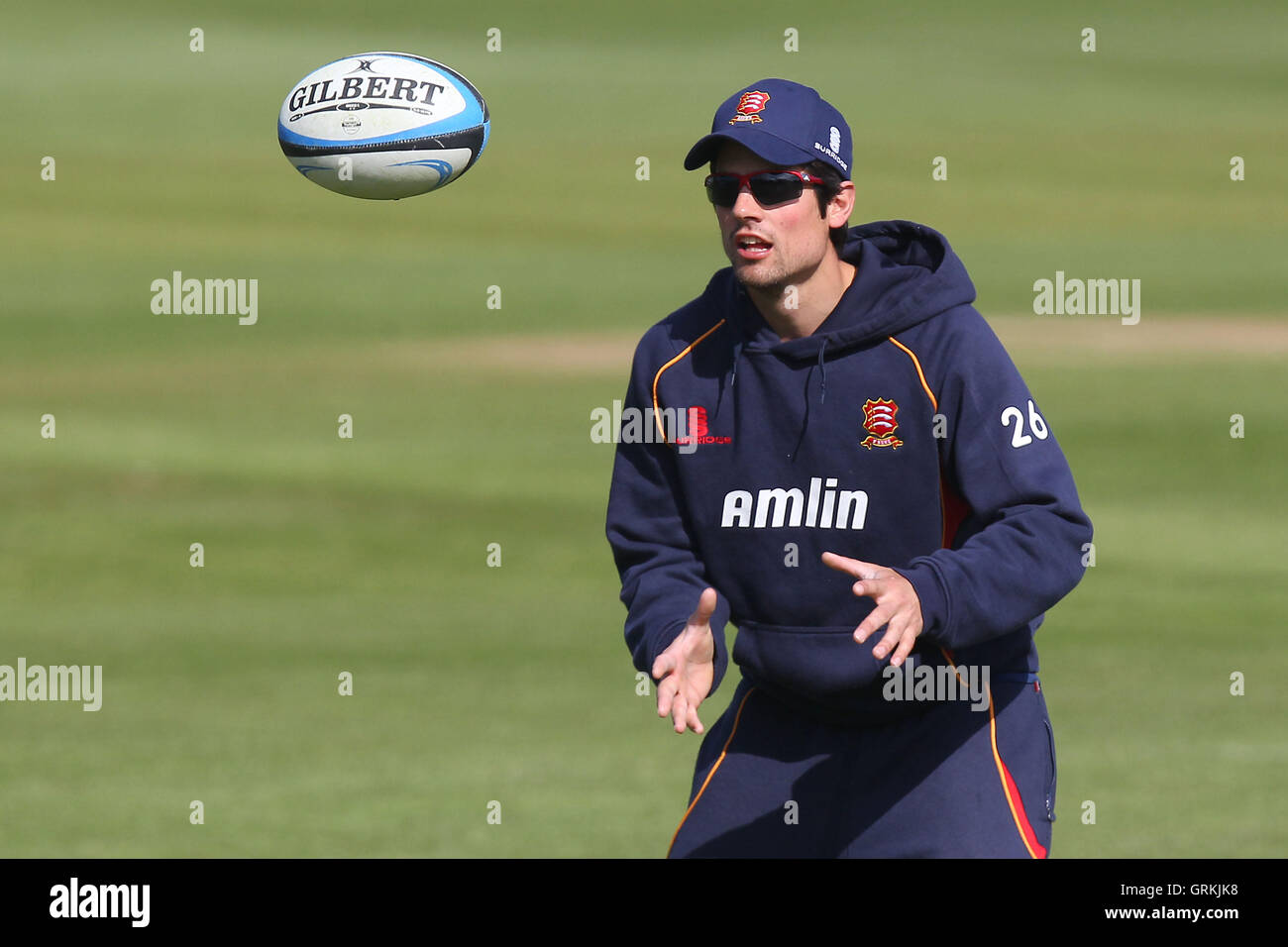 Alastair Cook of Essex catches a rugby ball during the warm up - Essex ...