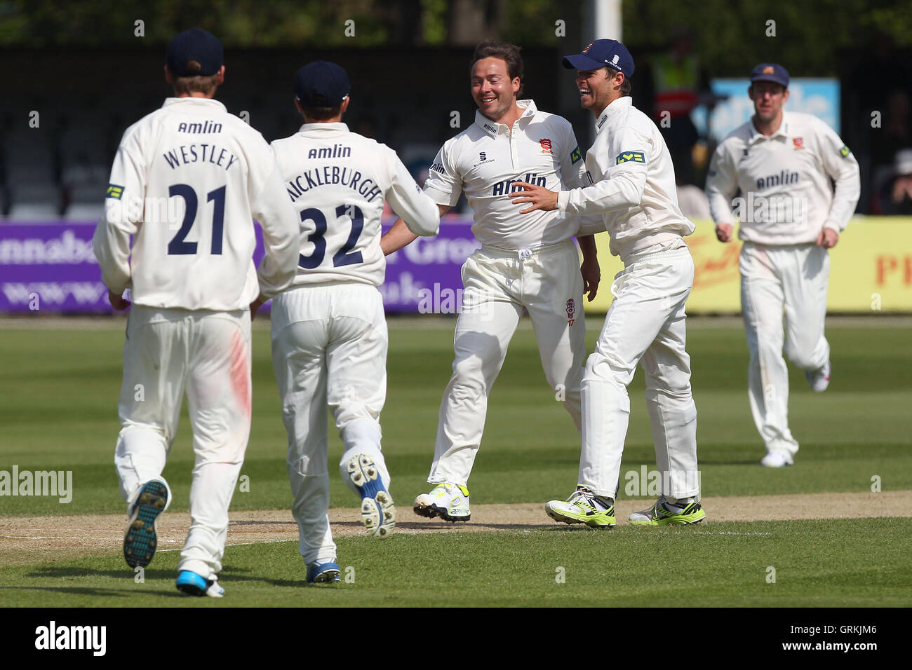 Graham Napier of Essex (C) celebrates the wicket of Richard Johnson ...