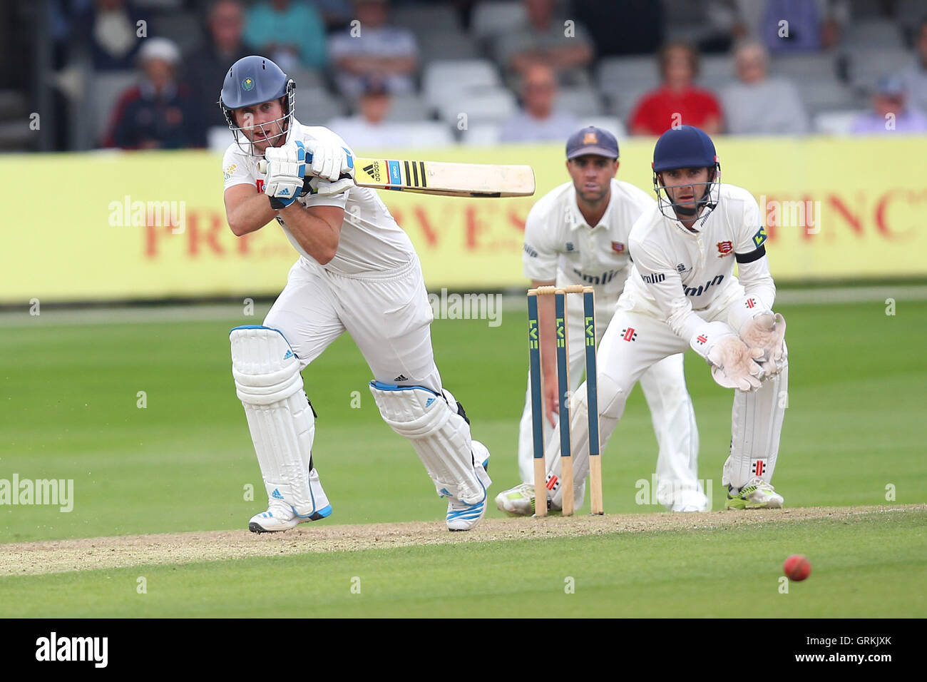 Chris Cooke in batting action for Glamorgan as James Foster looks on ...