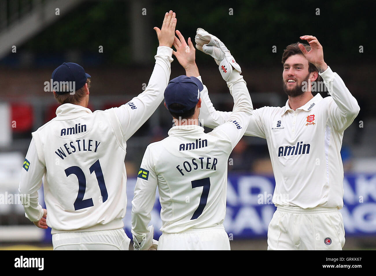 Reece Topley of Essex (R) celebrates taking the wicket of Tom ...
