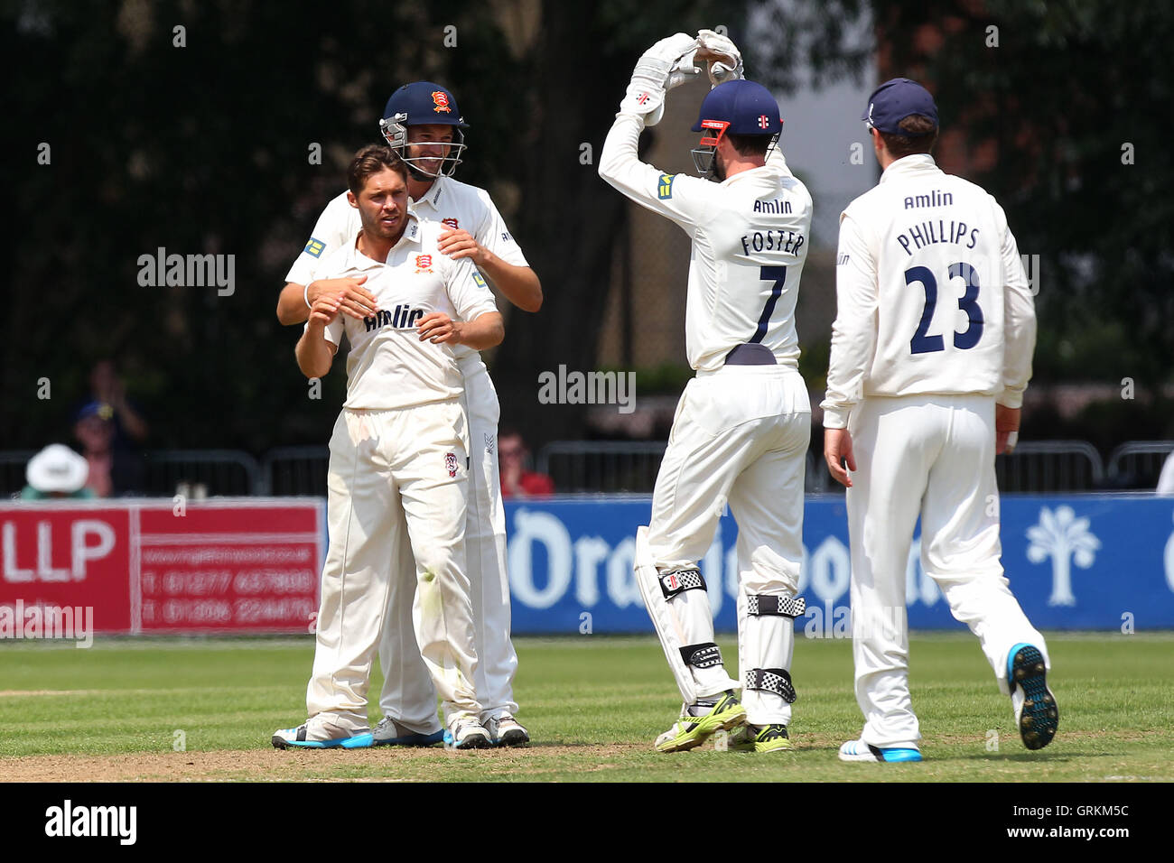 Greg Smith of Essex (L) celebrates the wicket of Danny Briggs with his ...