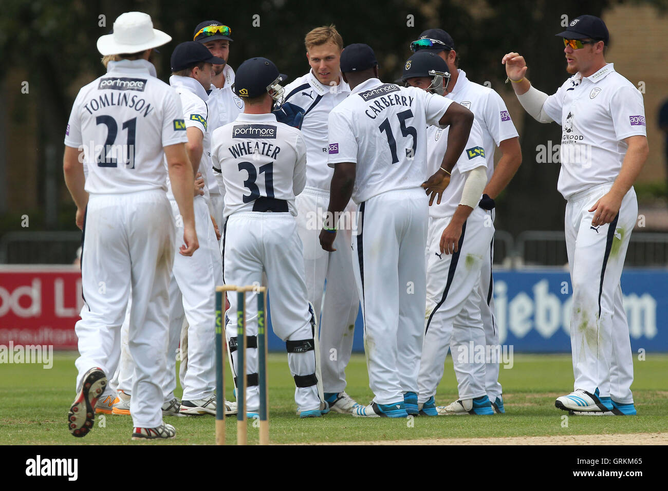 Danny Briggs (C) of Hampshire is congratulated on the wicket of James ...