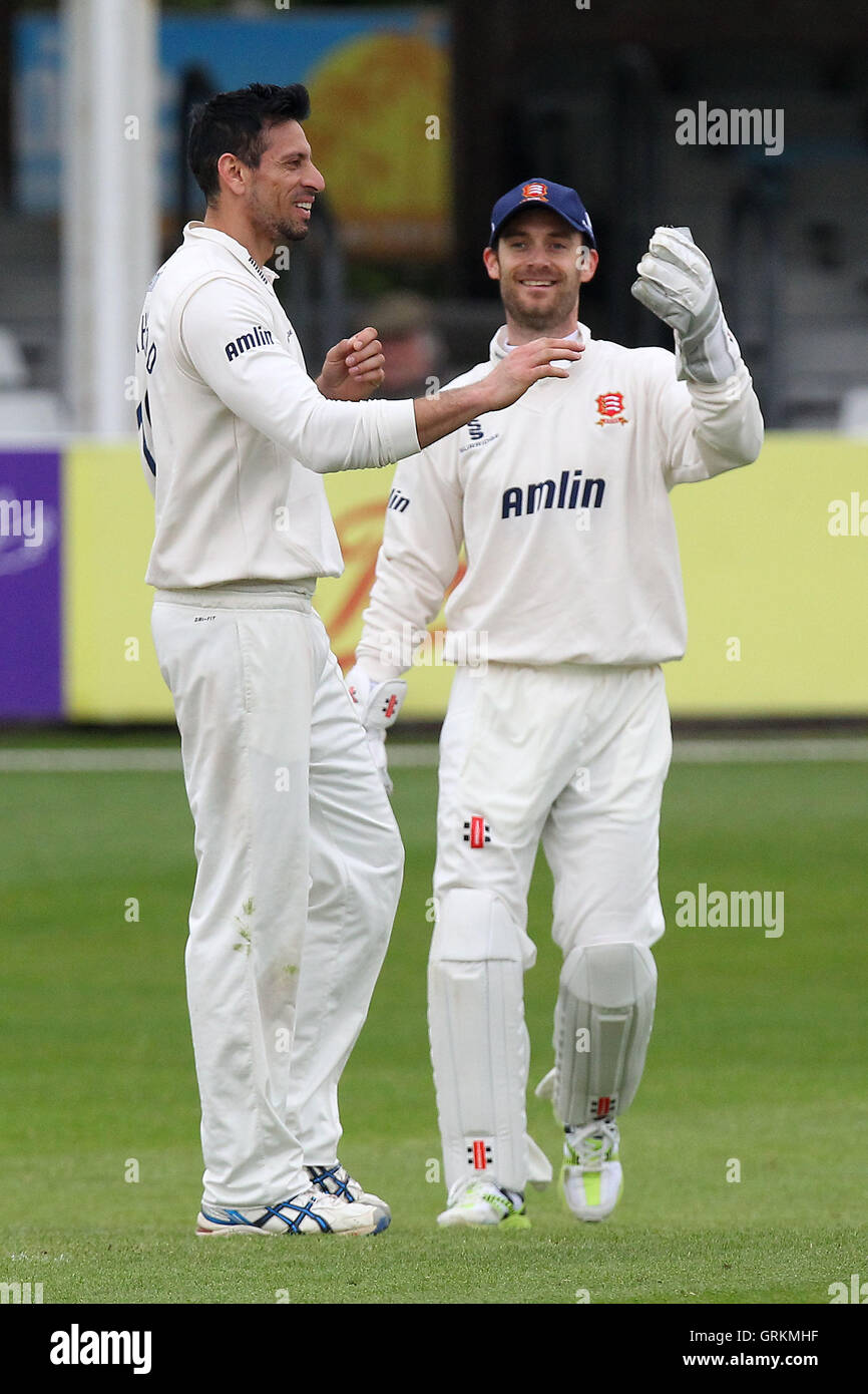 Saj Mahmood (L) of Essex celebrates the wicket of Ben Harmison with ...