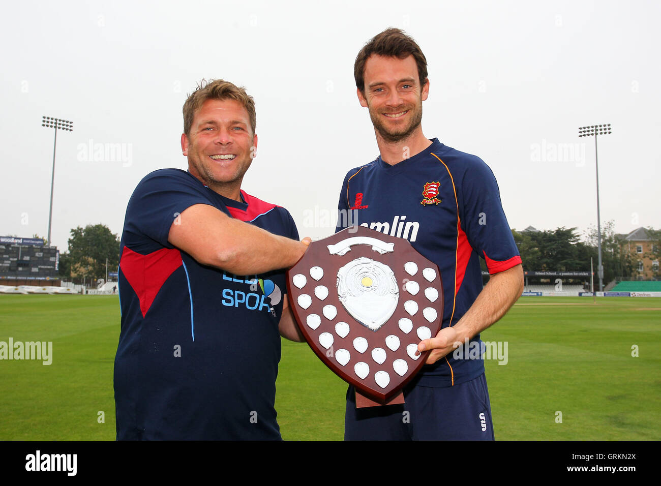 Matt Walker of Kent (L) hands over the Mike Denness Challenge Shield to ...