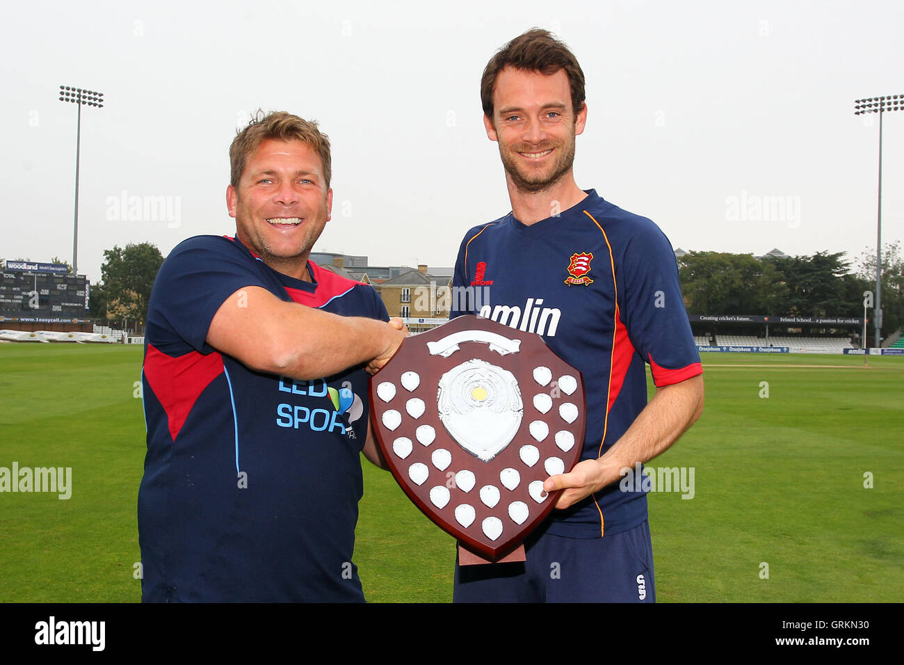 Matt Walker of Kent (L) hands over the Mike Denness Challenge Shield to ...