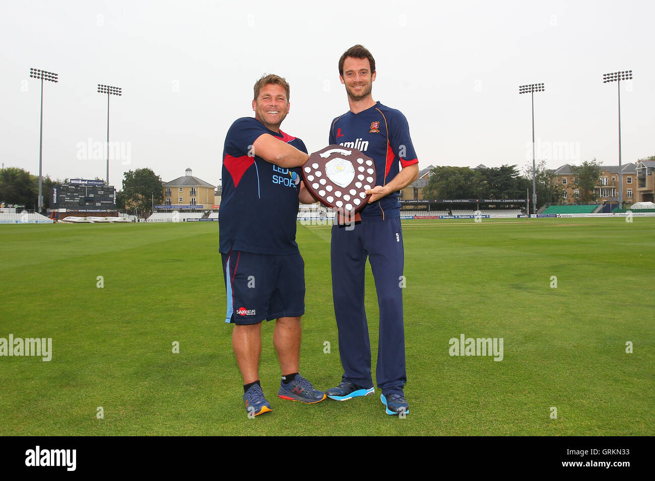 Matt Walker of Kent (L) hands over the Mike Denness Challenge Shield to ...