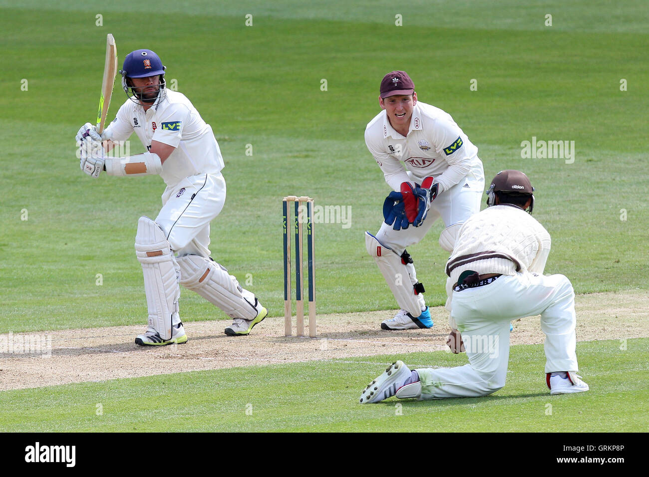 Arun Harinath (R) of Surrey takes a catch to dismiss Mark Pettini ...