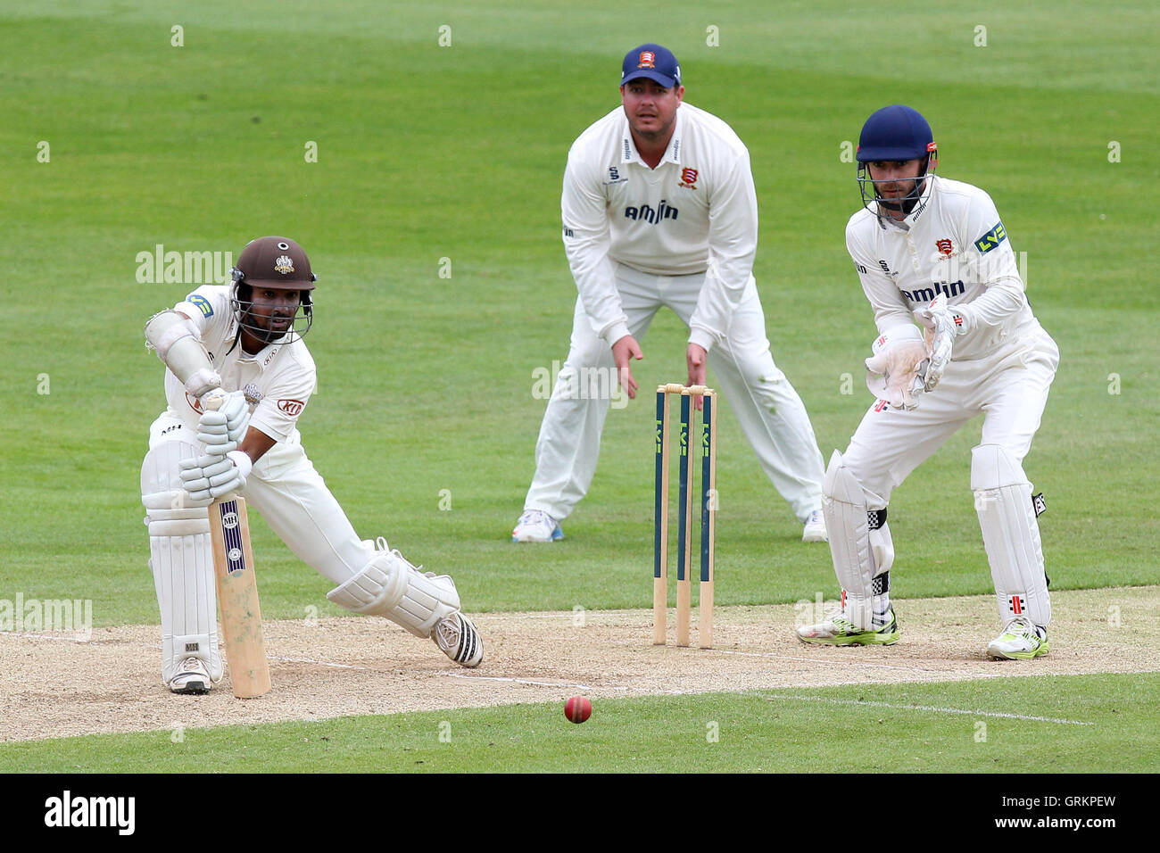 Arun Harinath of Surrey in batting action as James Foster (R) and Jesse ...