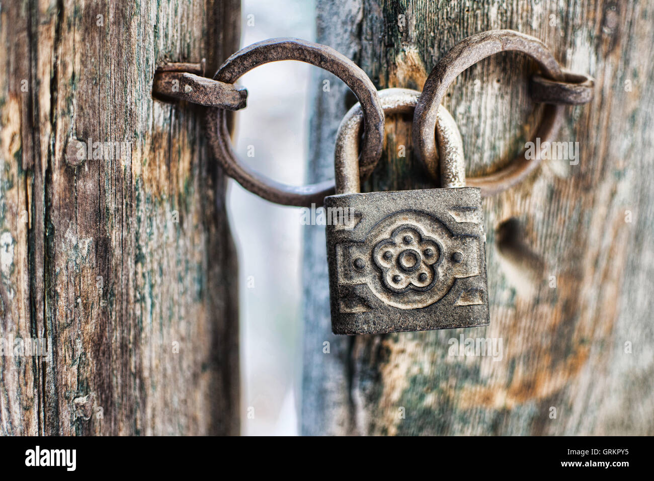 Old Rusty Decorated Padlock on a Wooden Door. Vintage Corroded Padlock ...