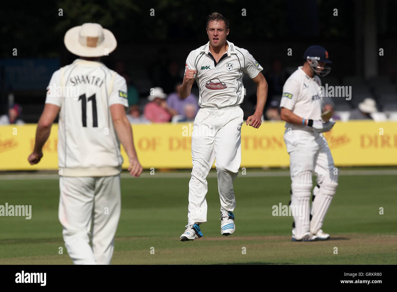 Charlie Morris of Worcestershire celebrates taking the wicket of Greg ...