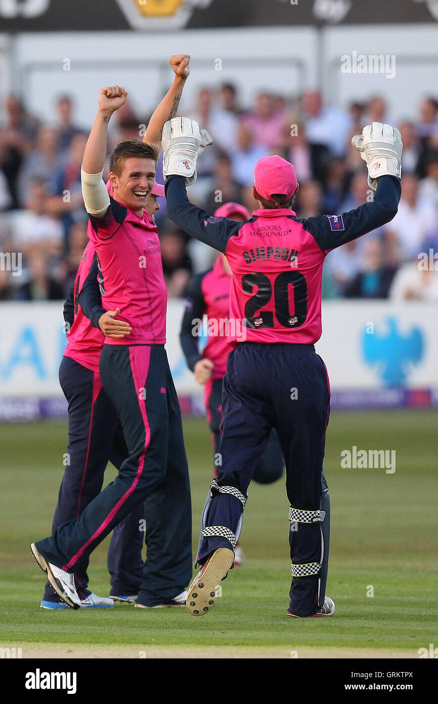 Harry Podmore of Middlesex (L) celebrates the wicket of Jesse Ryder ...