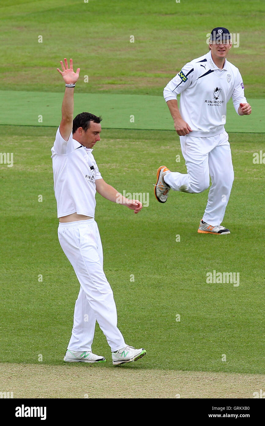 Kyle Abbott of Hampshire celebrates the wicket of Reece Topley ...