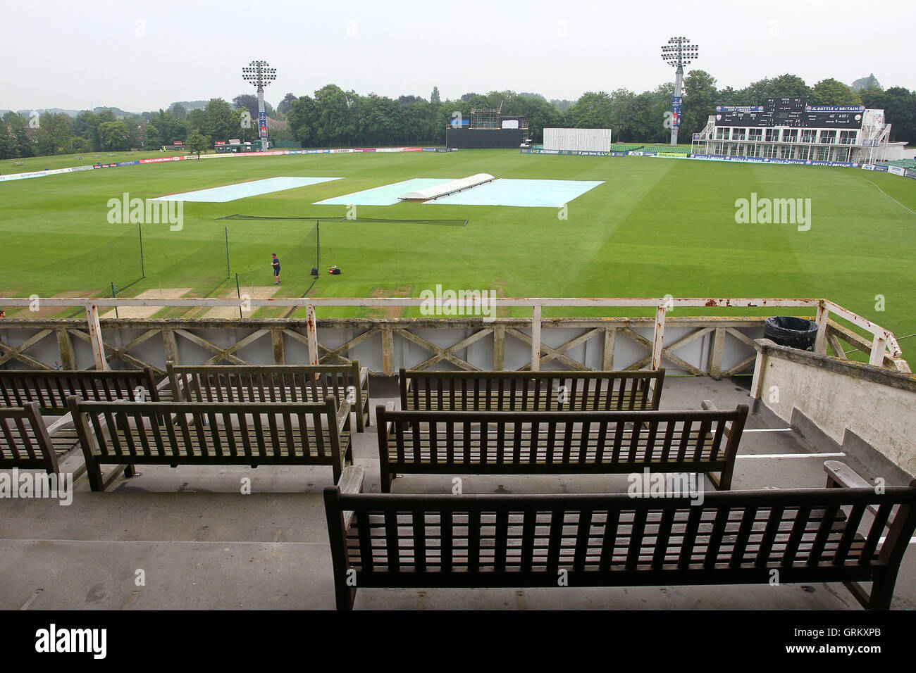 The covers are on the pitch as rain starts to fall ahead of play on Day ...