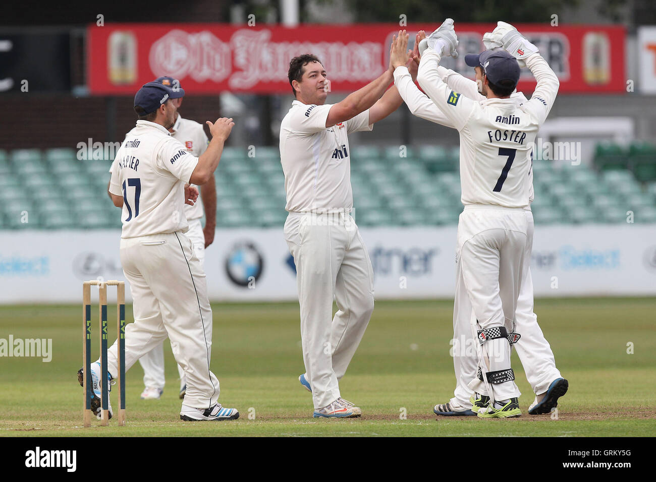 Jesse Ryder of Essex (C) celebrates taking the wicket of Angus Robson ...
