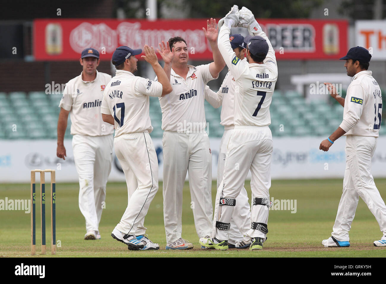Jesse Ryder of Essex (C) celebrates taking the wicket of Angus Robson ...