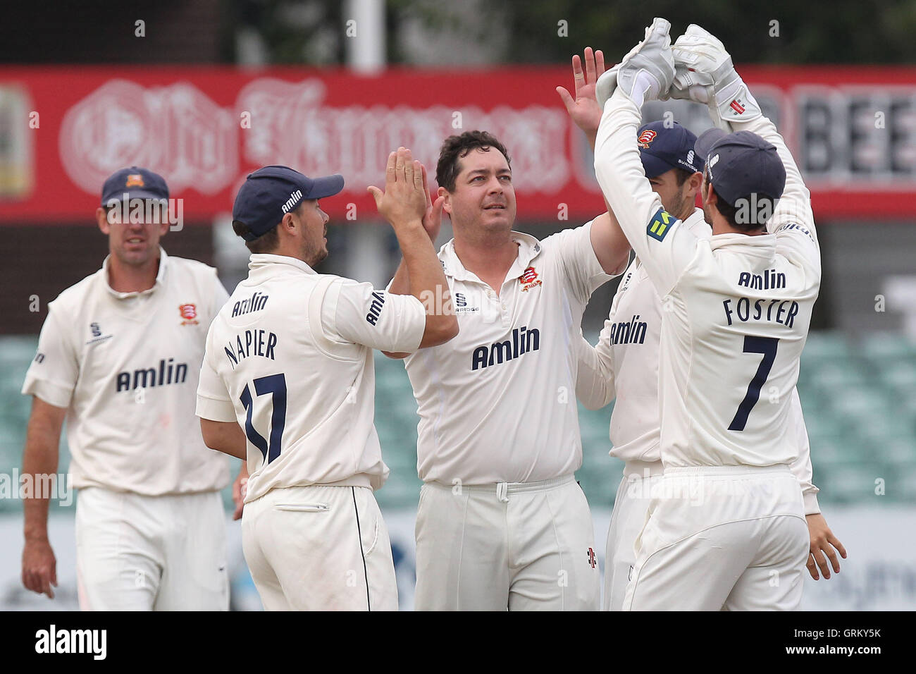 Jesse Ryder of Essex (C) celebrates taking the wicket of Angus Robson ...