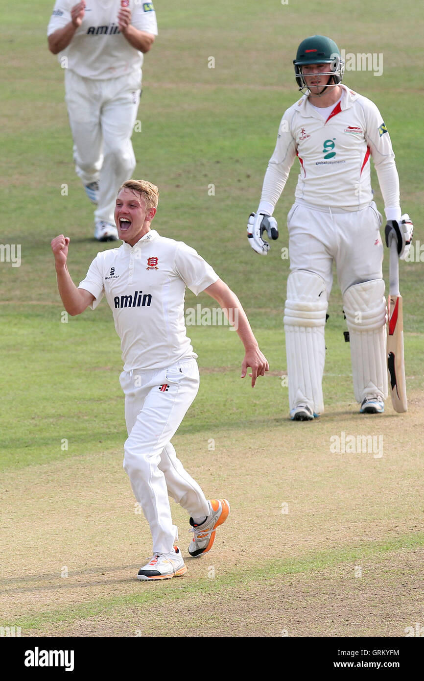 Jamie Porter of Essex celebrates taking the wicket of Angus Robson ...