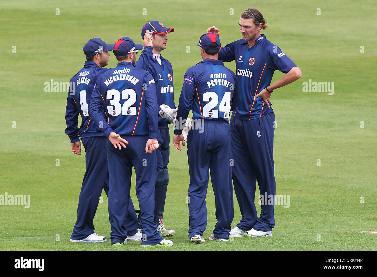 Oliver Newby of Essex (R) is congratulated on a wicket ...