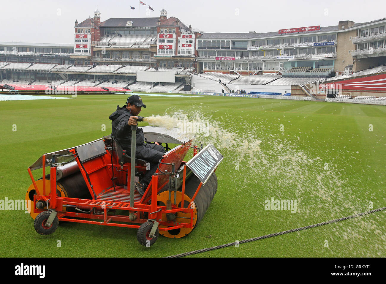 A Super Sopper is used to remove water from the outfield on Day One ...
