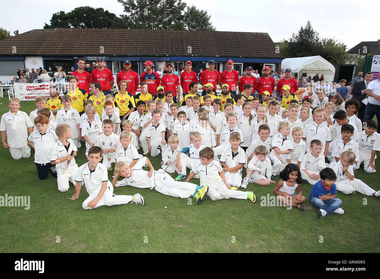 The teams pose and young players for a photograph - Upminster CC vs ...