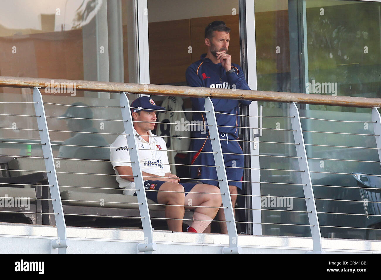 Essex head Paul Grayson (R) and Graham Napier (injured) look on from ...