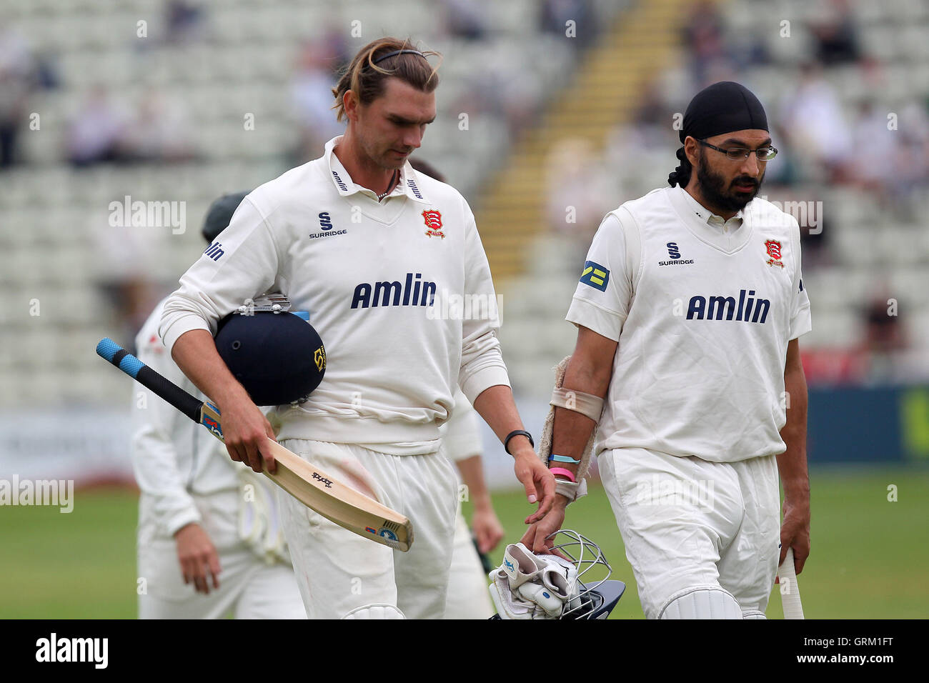 Despair for Oliver Newby (L) and Monty Panesar of Essex as they leave ...