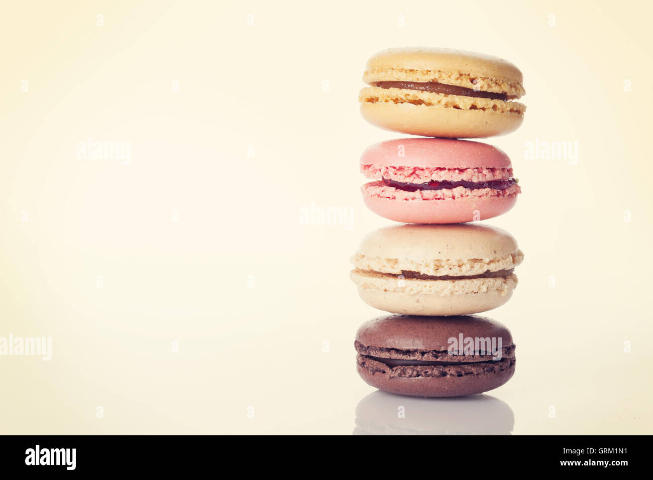 Colorful macaroons. Sweet macarons over color background with copy ...
